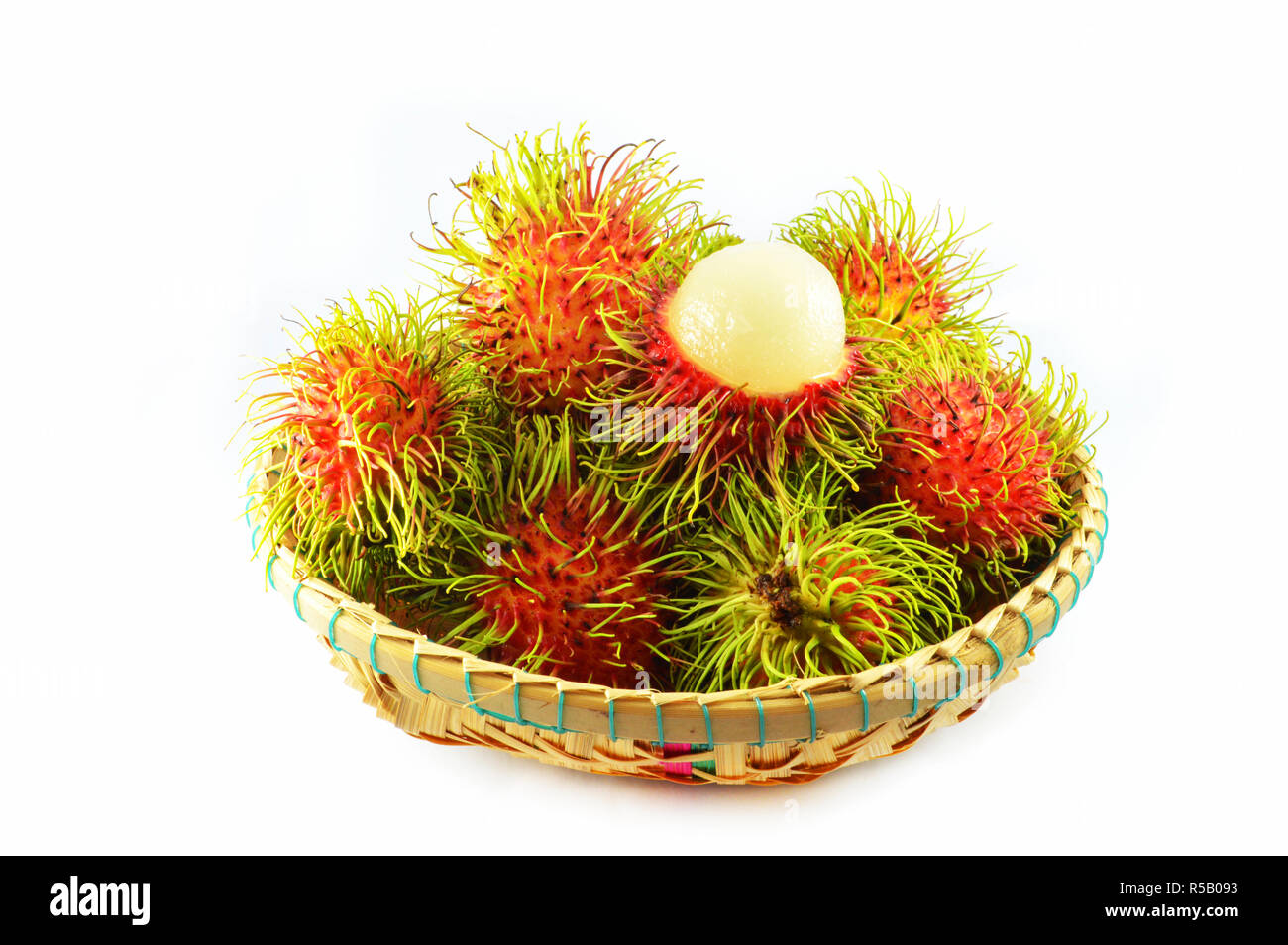 harvest rambutan fruit on basket isolated / ripe of red and green ...