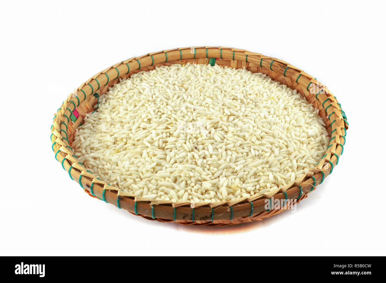 raw rice in bamboo basket isolated / thai sticky white rice on ...