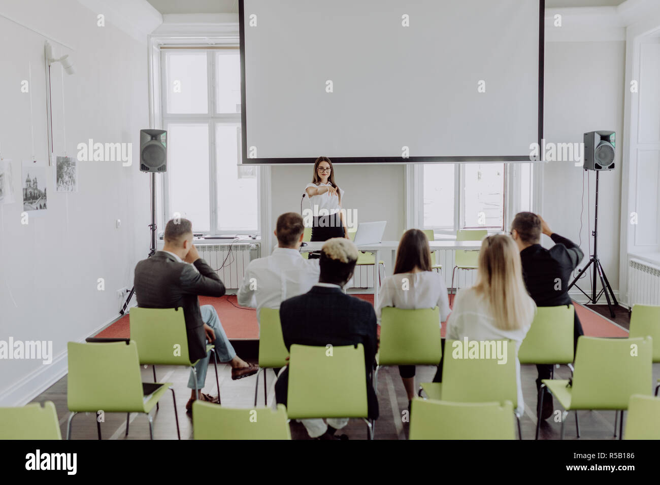 Successful businesswoman giving presentation to business team, female ...