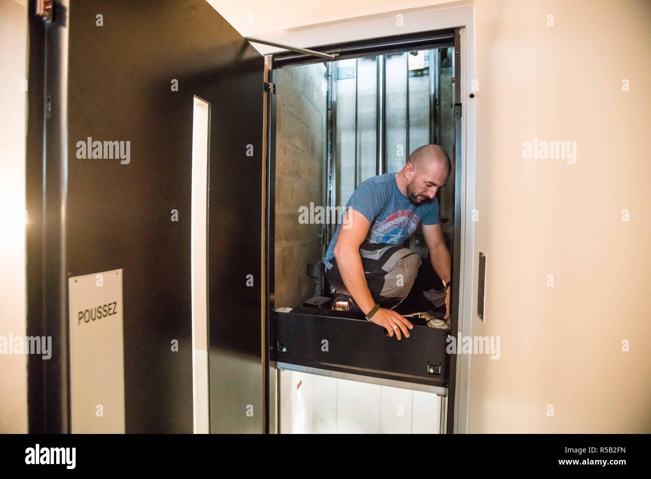 Repairing a lift Stock Photo - Alamy