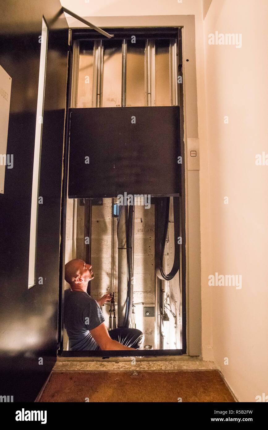 Repairing a lift Stock Photo - Alamy