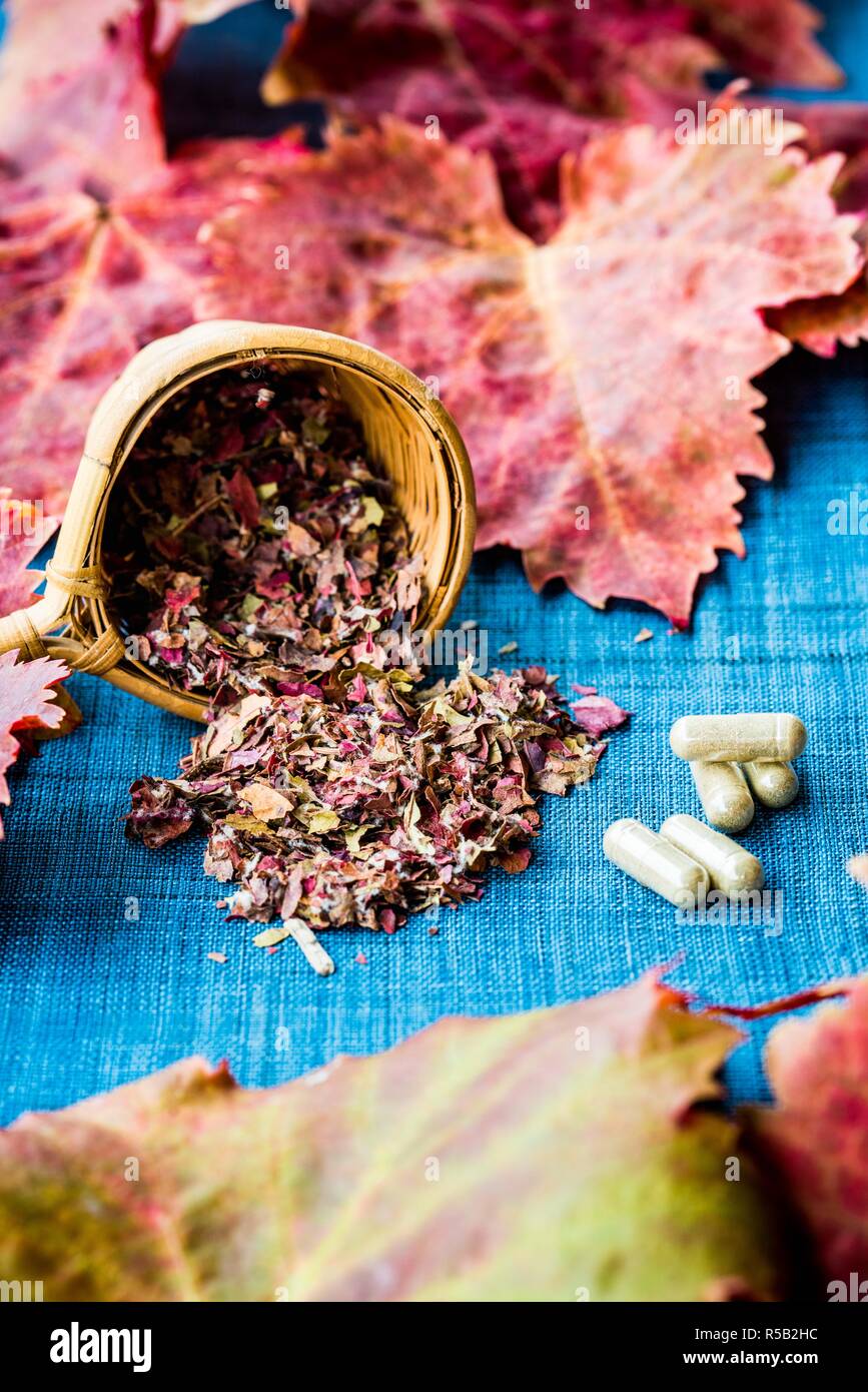 Organic red vine capsules Stock Photo - Alamy