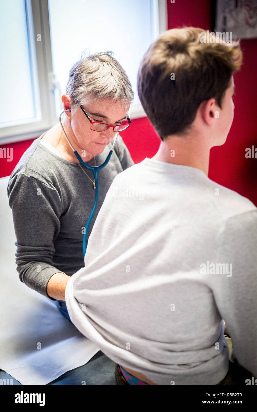General practitioner with patient, Geveze, France Stock Photo - Alamy