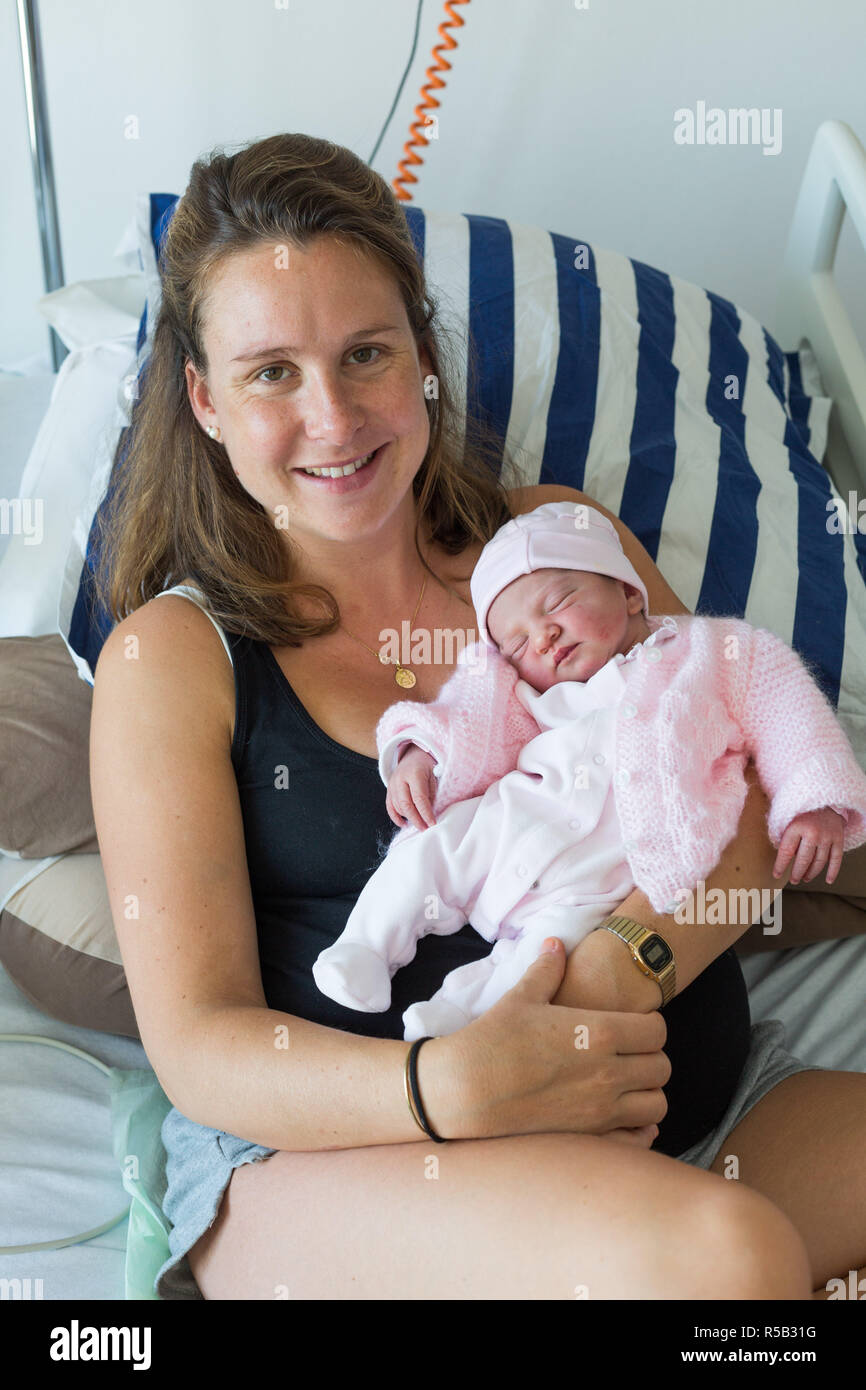 Mother with her one day baby girl Stock Photo - Alamy