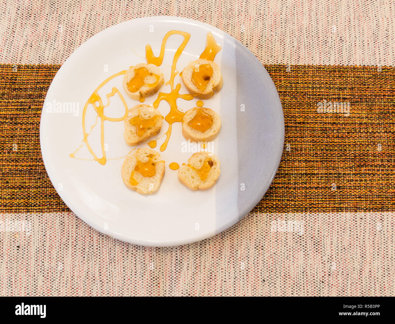 Healthy food, small slices of toast with honey Stock Photo - Alamy