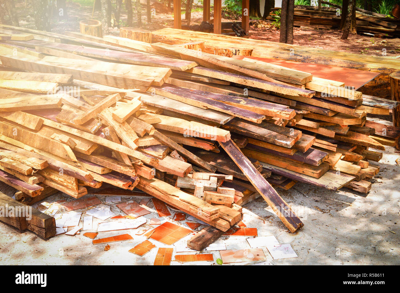 pile of old wood plank remnant from construction / pile used timber ...