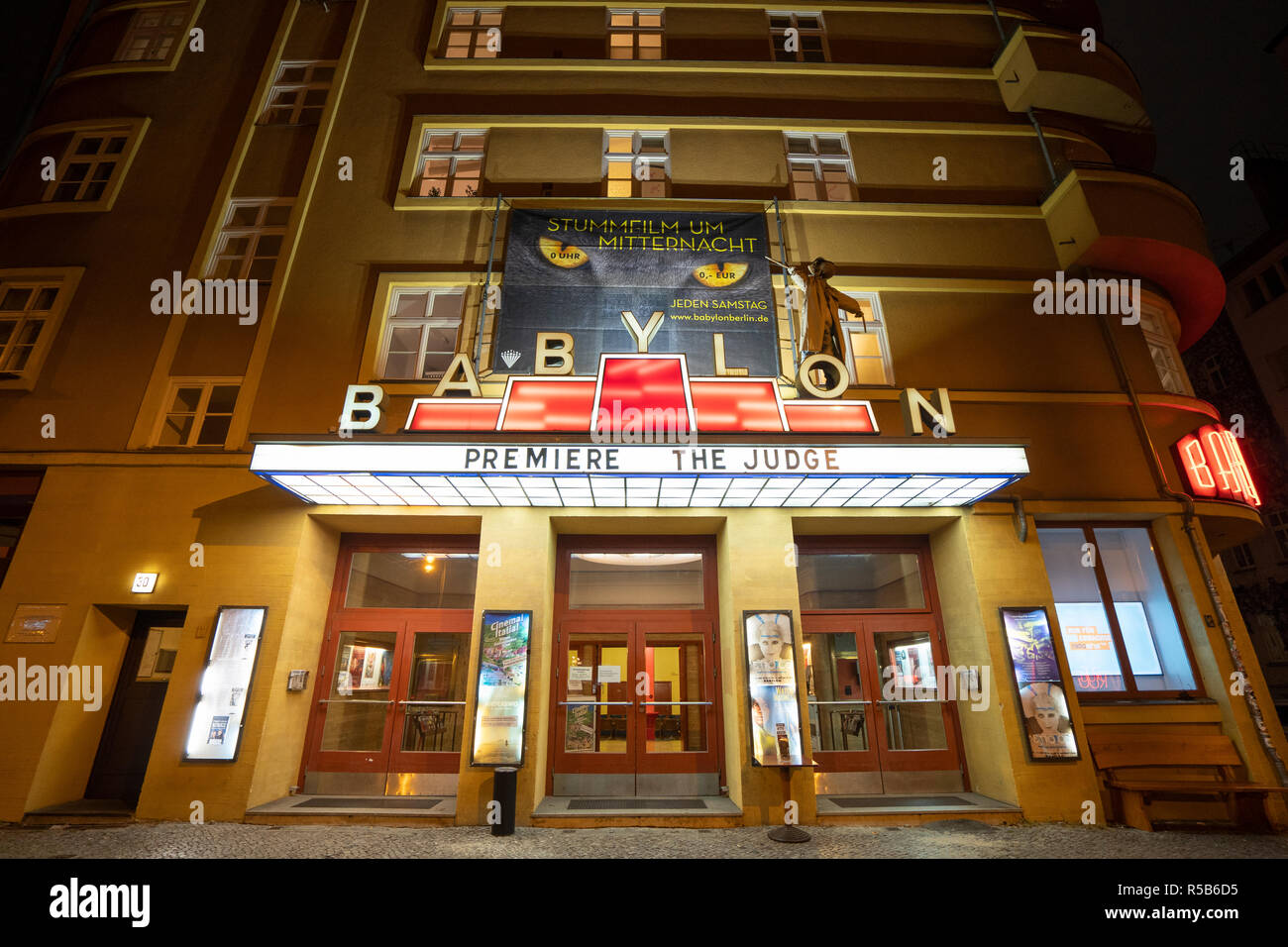 Exterior view of Babylon cinema at night in Mitte, Berlin, Germany ...