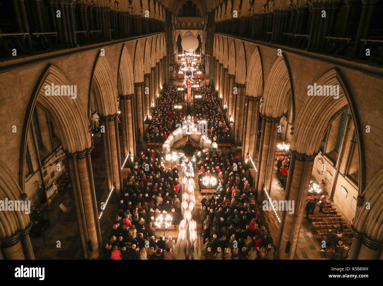 Candles are carried through Salisbury Cathedral during the advent ...