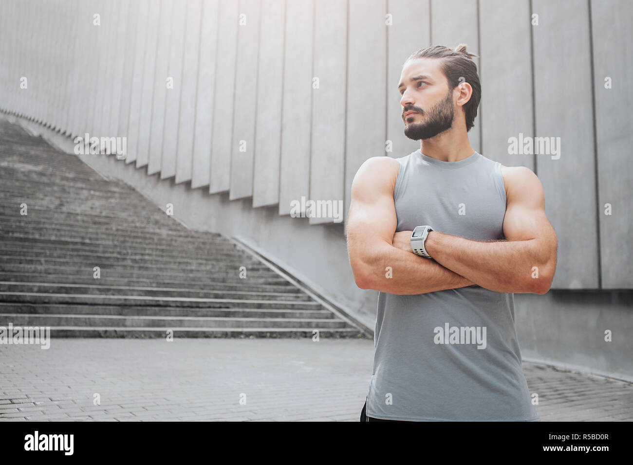 Picture of strong and well-built young man standing and posing on ...