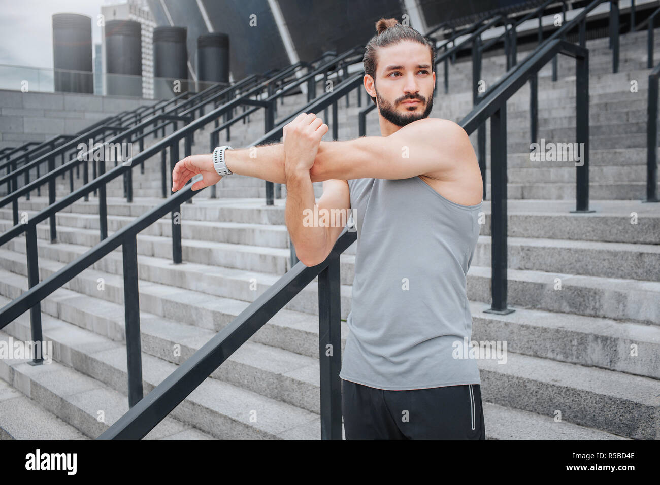Athlete man stretches hands on hi-res stock photography and images - Alamy