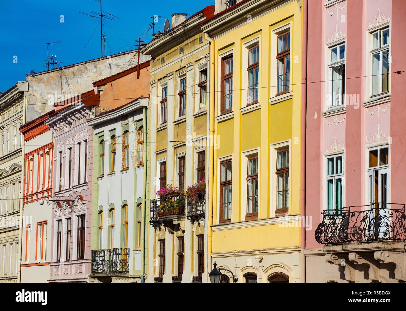 colorful facades of old buildings at the main square of beautiful town ...