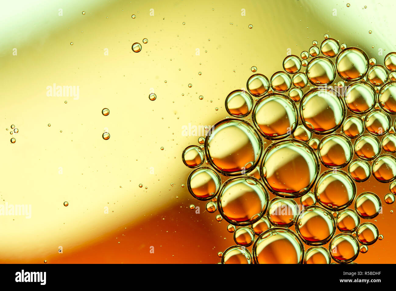 Abstract background of close up detail in vegetable oil droplets ...