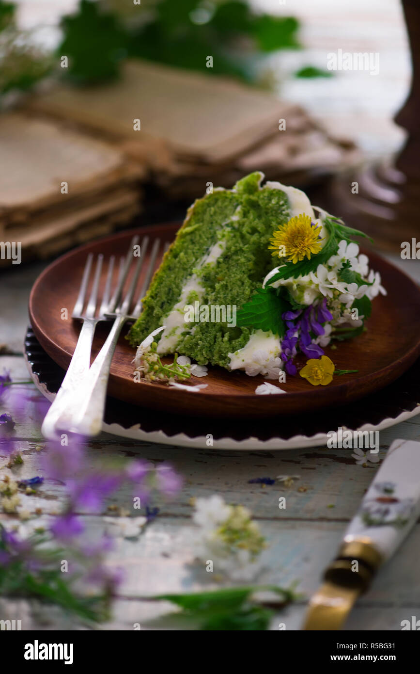 NETTLE AND LEMON CAKE WITH LEMON ICING .food gathering.selective focus ...