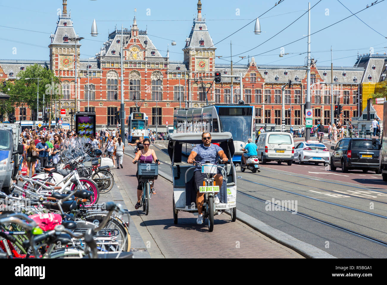 Amsterdam, The Netherlands. Railway Station and Damrak Street Scene ...