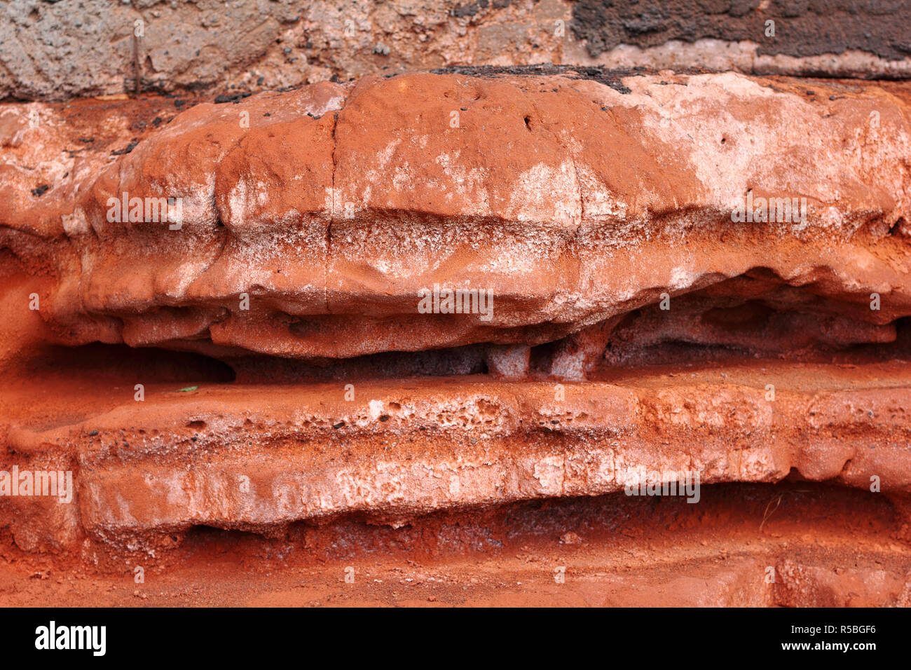 Red tuff at the South coast of Madeira Stock Photo - Alamy