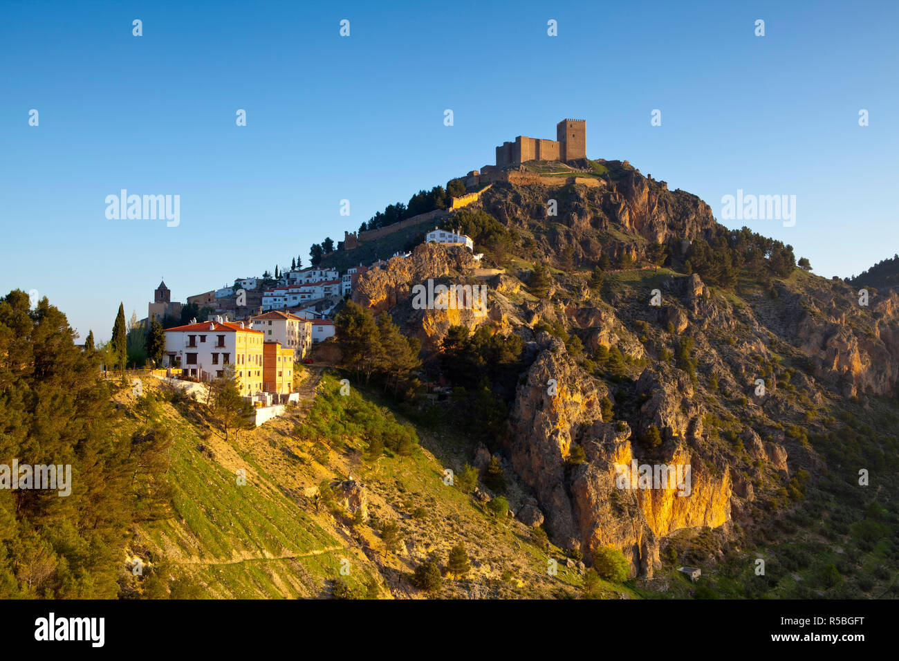 The Mudejar Castle overlooking the mountain village of Segura de la ...