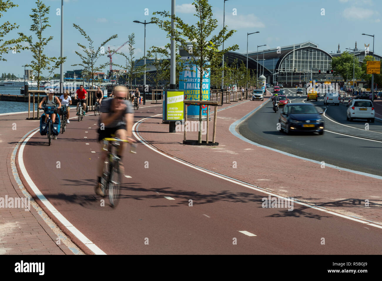 Amsterdam, The Netherlands. Commuters Using Bicycle Lane for Riding ...
