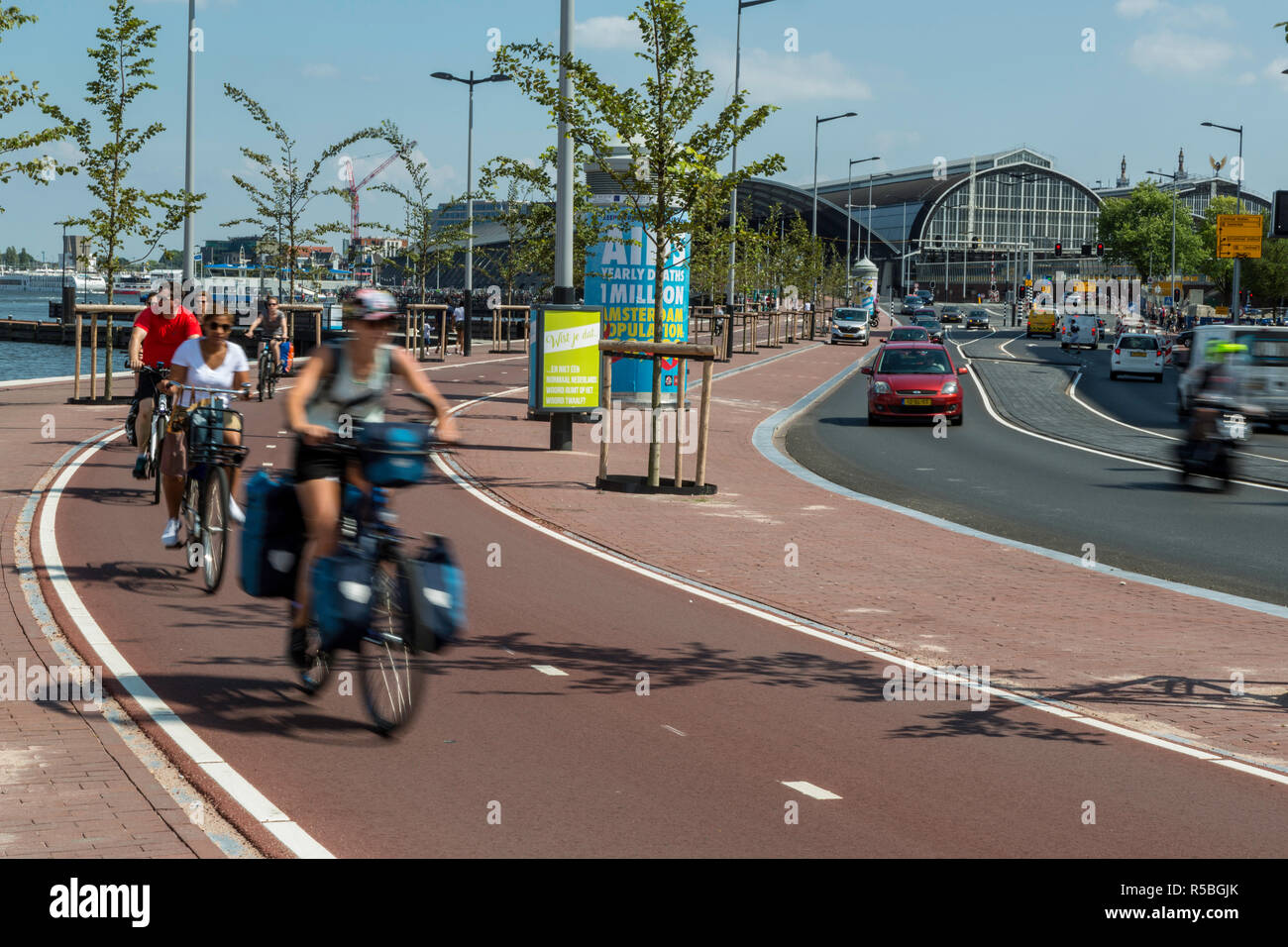 Amsterdam, The Netherlands. Commuters Using Bicycle Lane for Riding ...