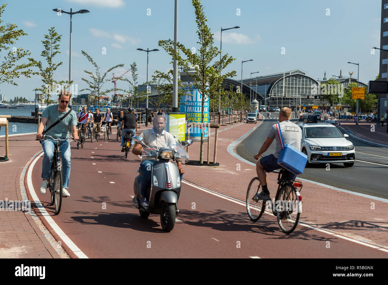 Amsterdam, The Netherlands. Commuters Using Bicycle Lane for Riding ...
