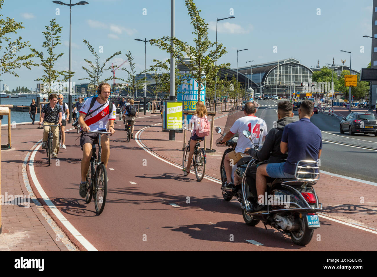 Amsterdam, The Netherlands. Commuters Using Bicycle Lane for Riding ...