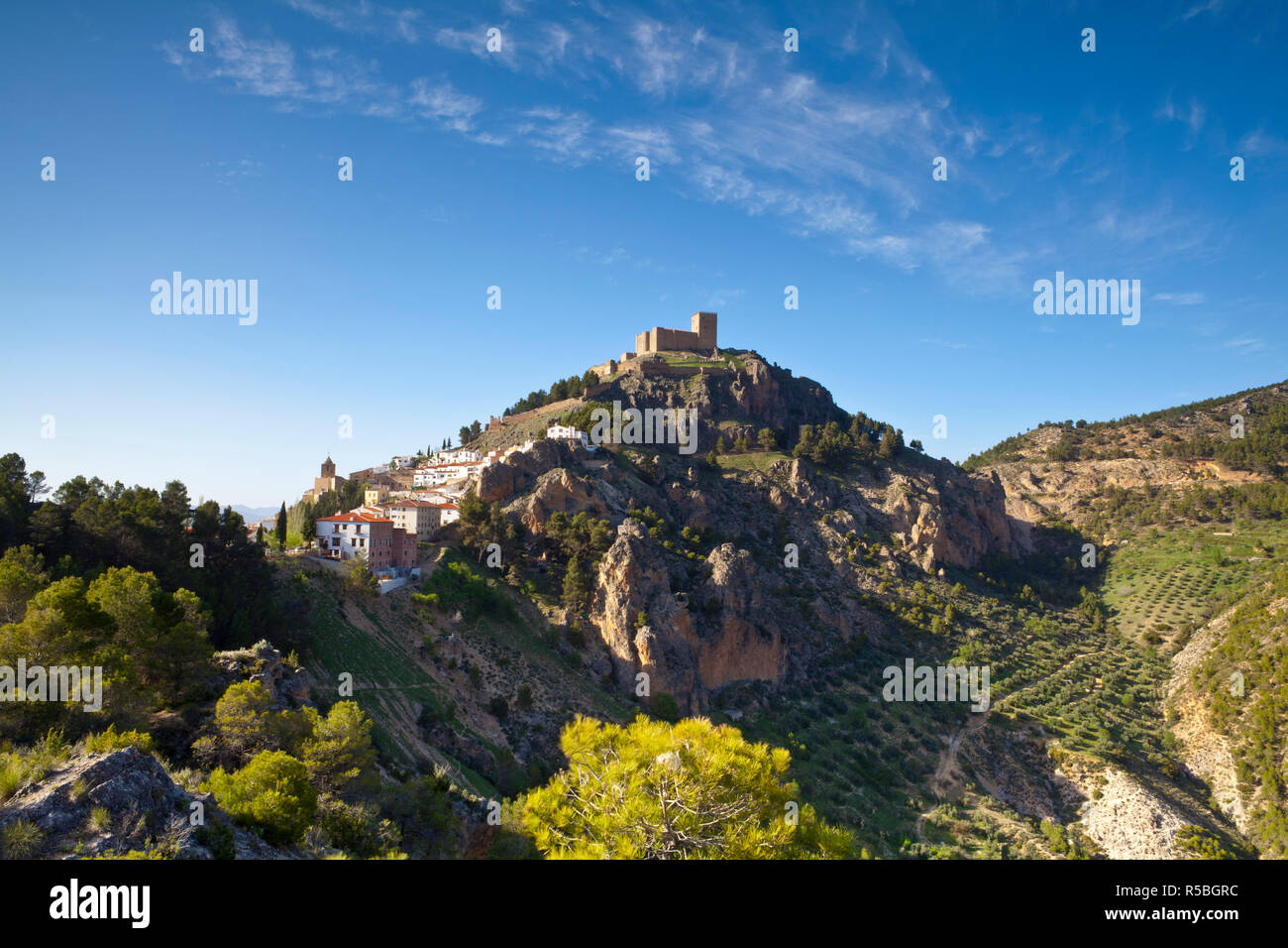 The Mudejar Castle overlooking the mountain village of Segura de la ...
