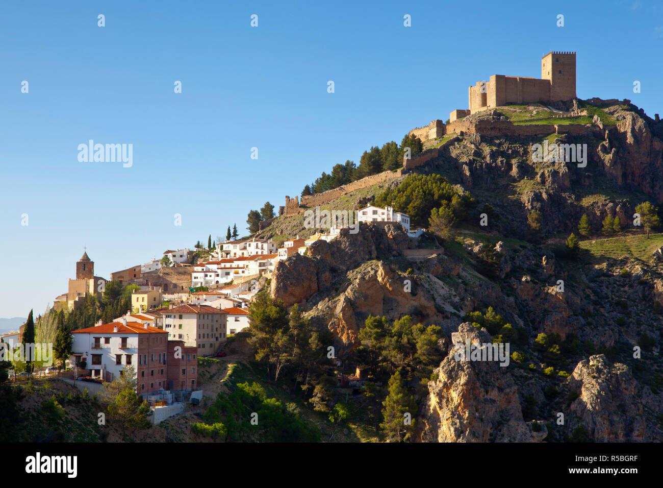 The Mudejar Castle overlooking the mountain village of Segura de la ...