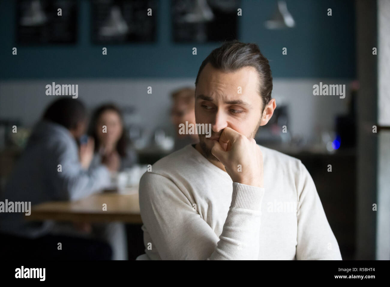 Upset millennial outsider feel offended lack company, young outcast guy ...