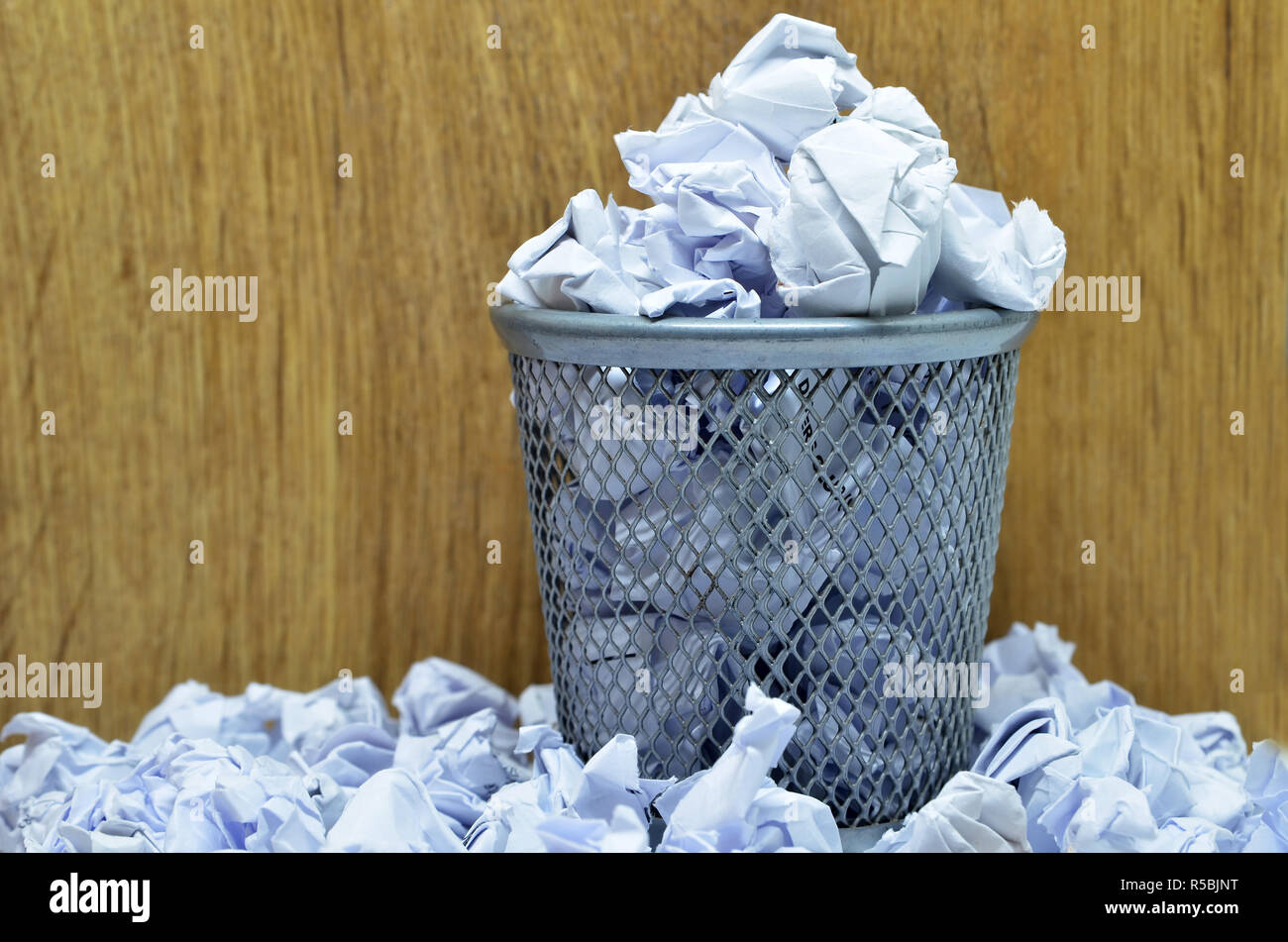 Garbage bin with paper waste Stock Photo - Alamy