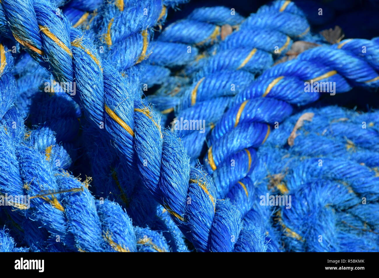 mooring rope in blue Stock Photo - Alamy