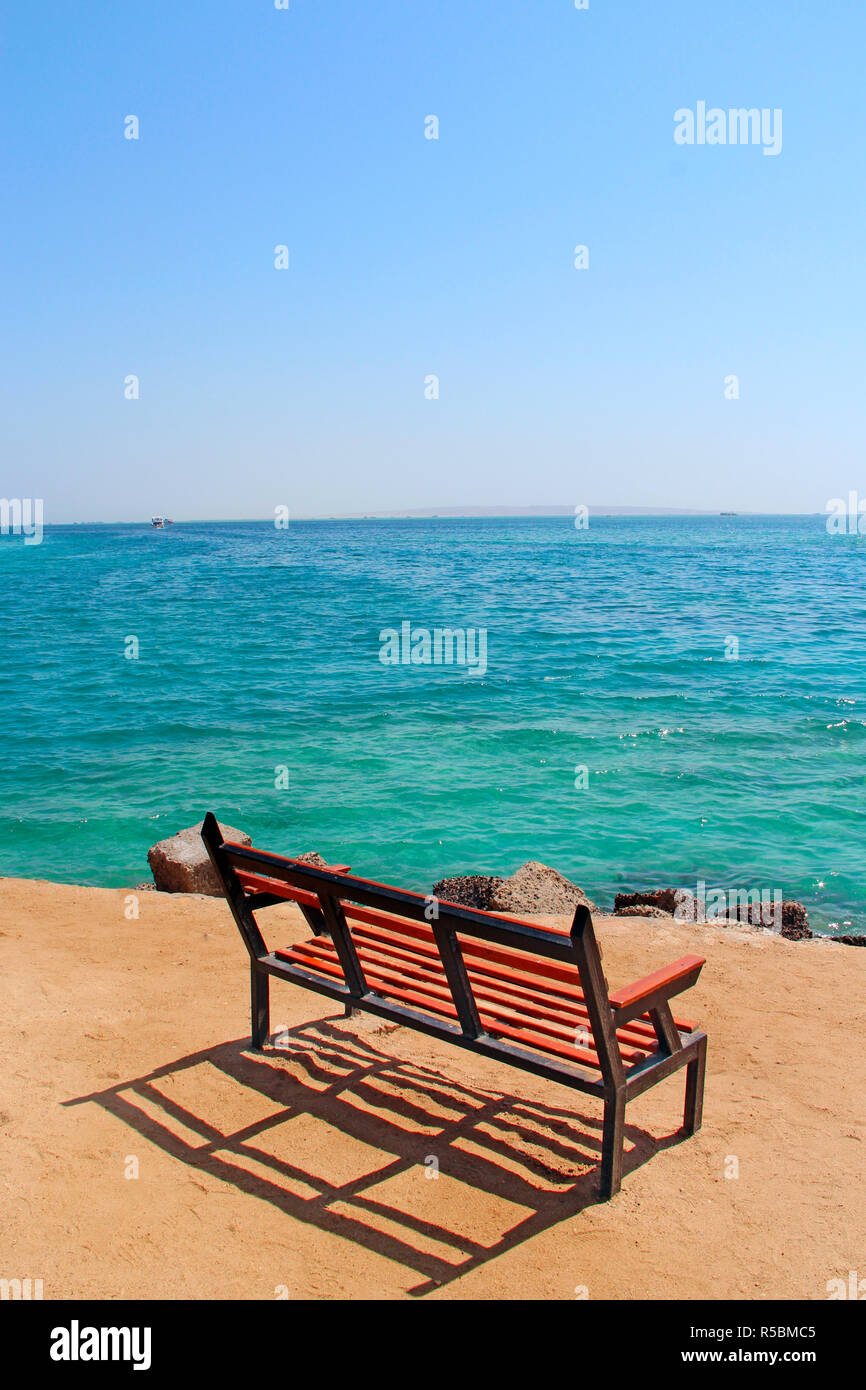 Empty bench near sea. Lonely bench on beach near Red sea. Exotic ...