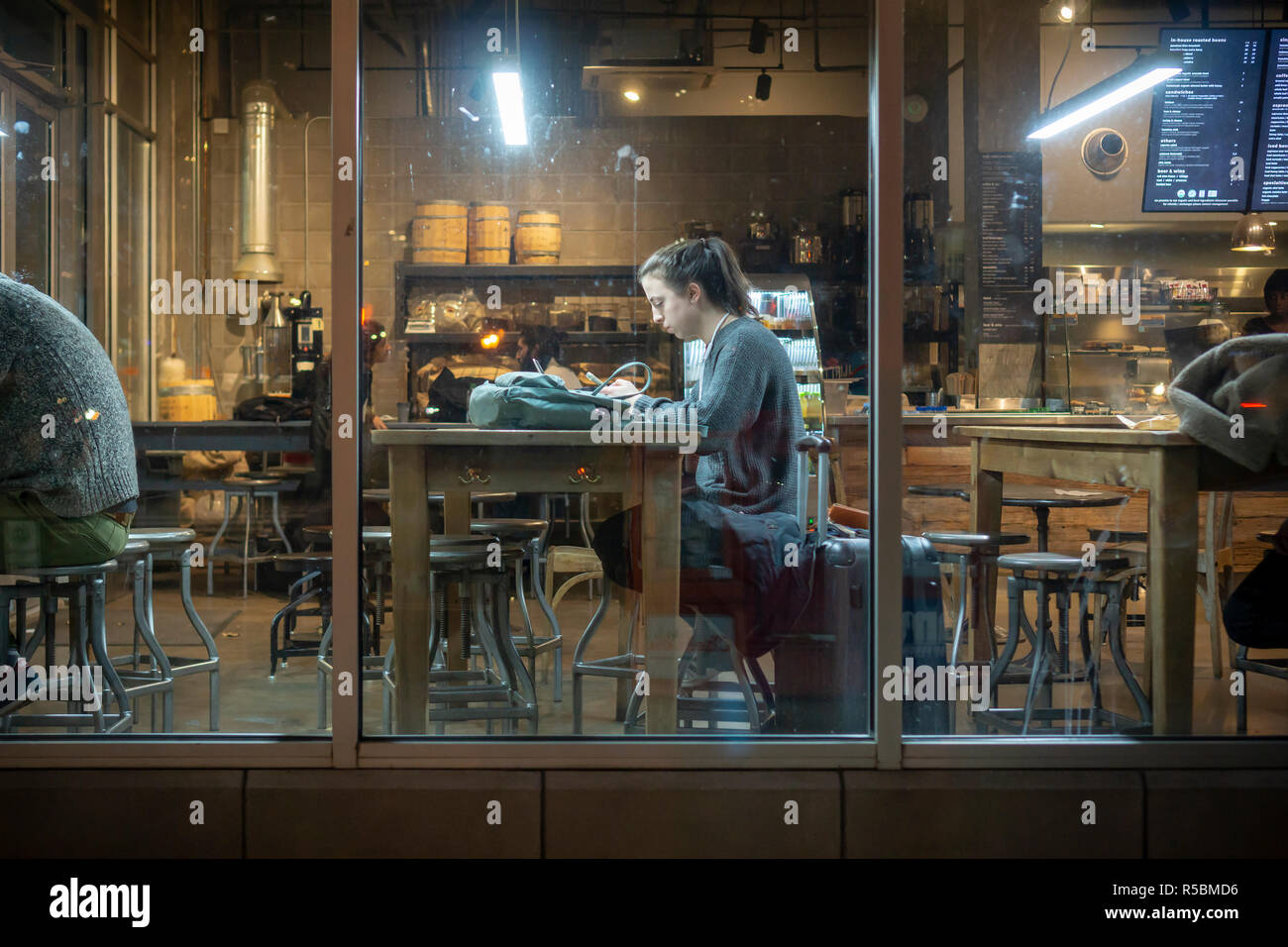Communal tables in cafe hi-res stock photography and images - Alamy