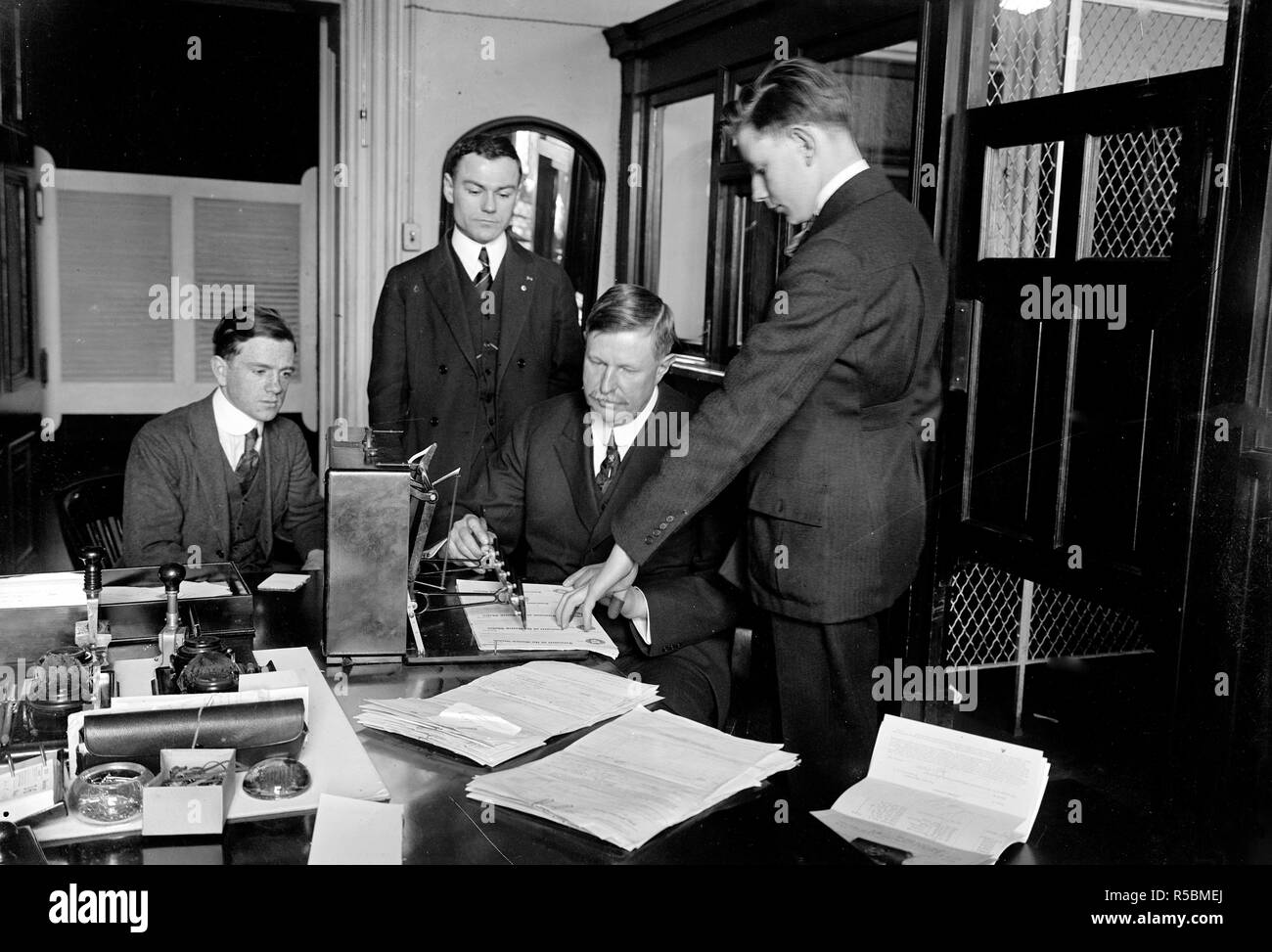 Check signing machine in Treasury Department; operated by J.L. Summers ...