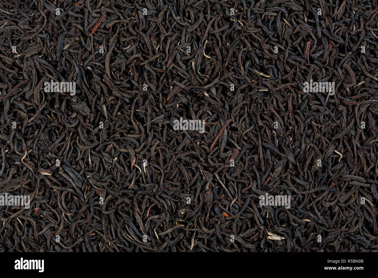 Gold of Taprobane Ceylon black tea texture Stock Photo - Alamy