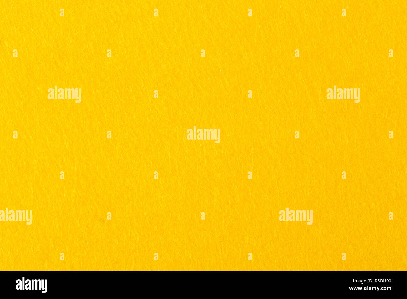 Abstract background with high quality yellow felt Stock Photo - Alamy