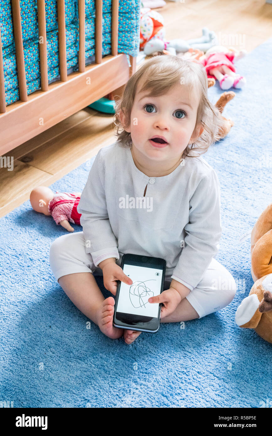 16 month old baby girl with cell phone Stock Photo - Alamy