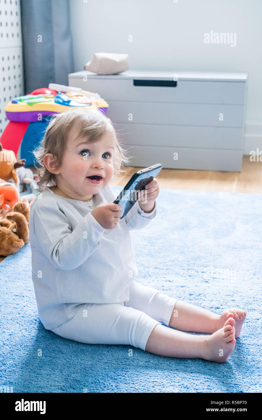 16 month old baby girl with cell phone Stock Photo - Alamy