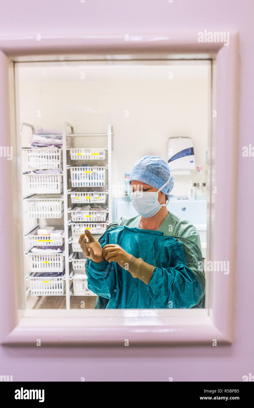 Surgical team getting dressed before surgery, Angoulême hospital ...
