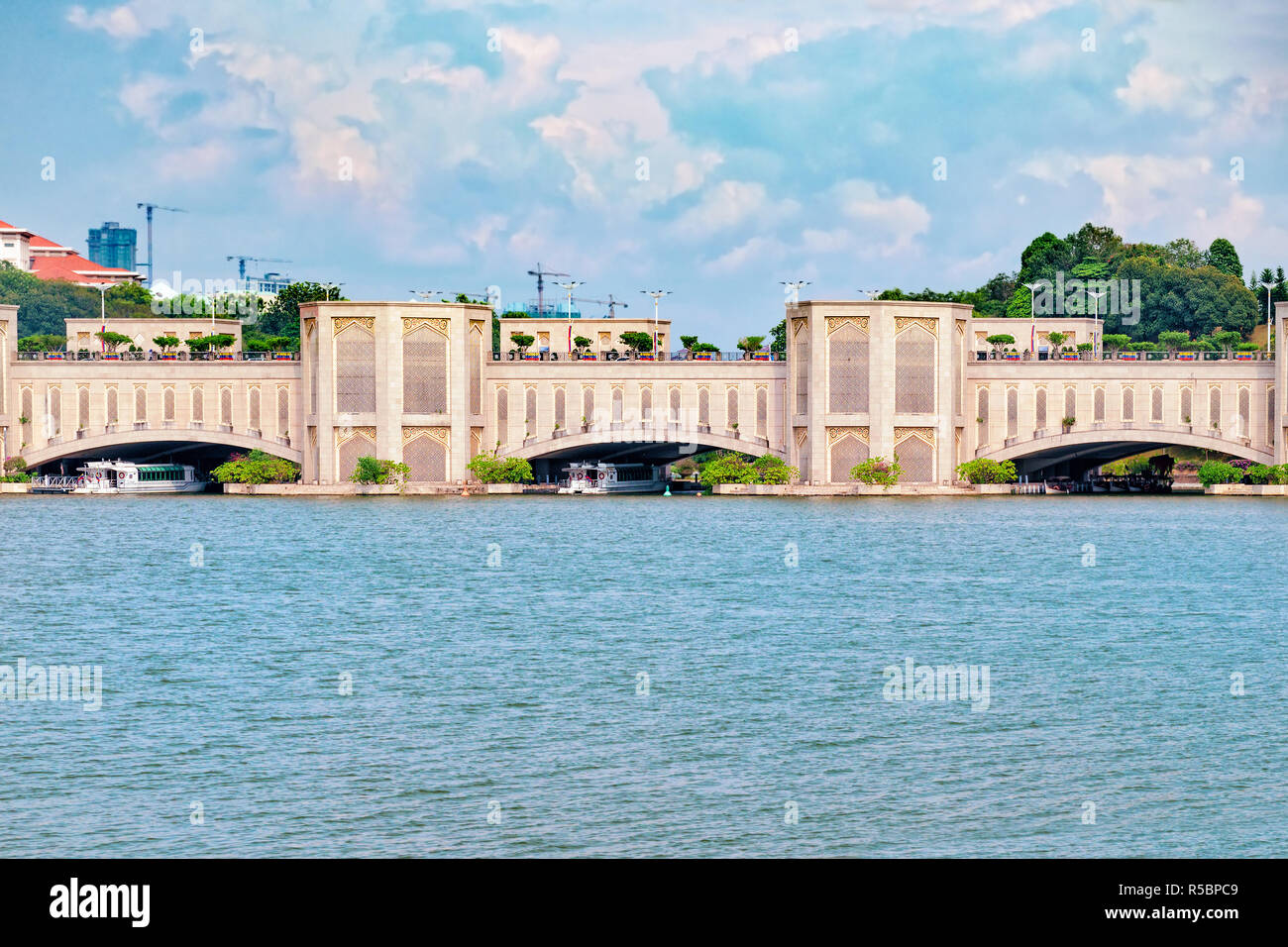 View of arched bridge over the river, shipping construction. Details of ...