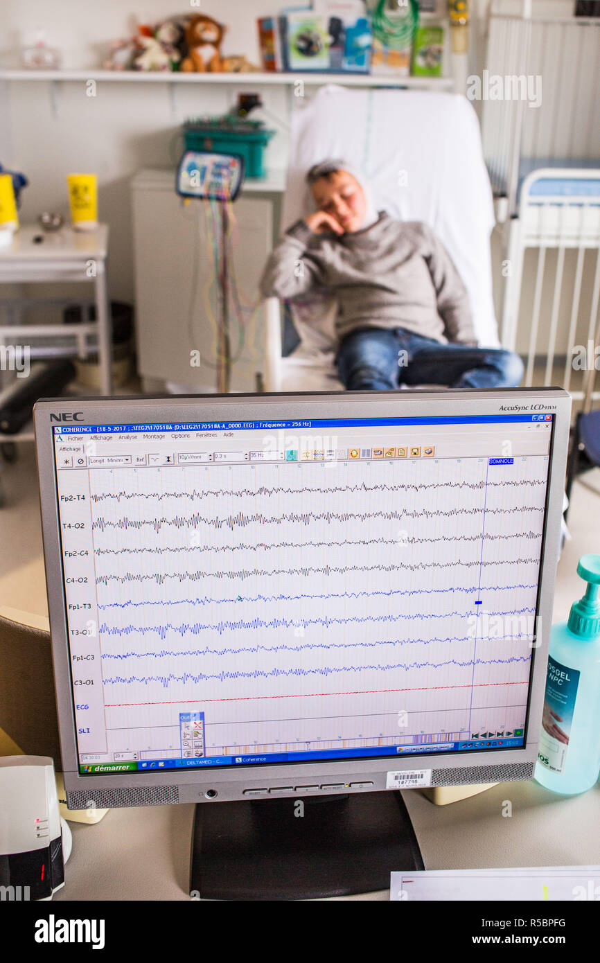 Child undergoing an electroencephalogram (EEG), epilepsy screening ...