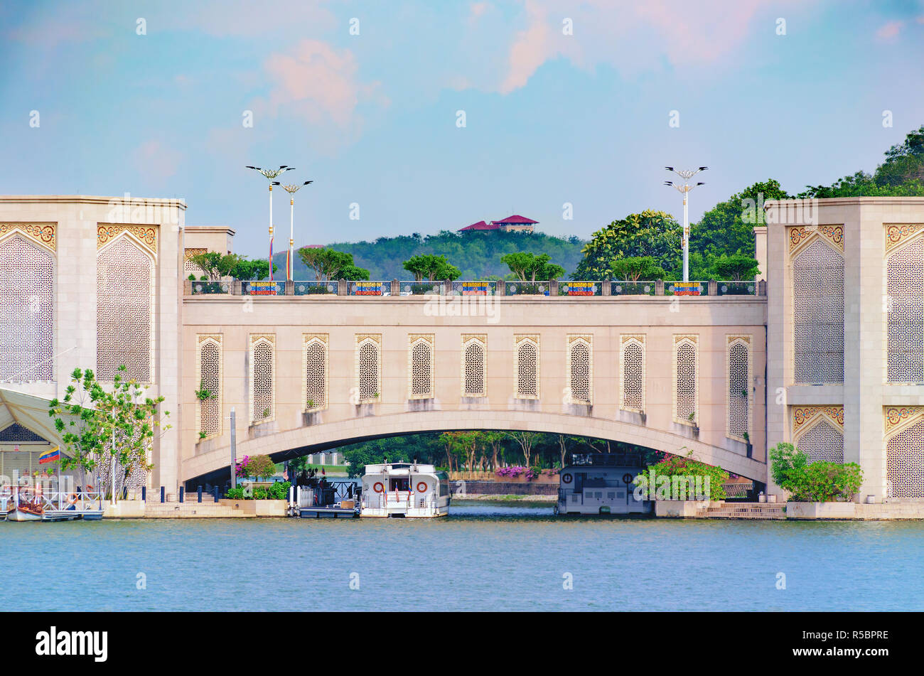 Span of arched bridge over the river. View of the water bridge ...
