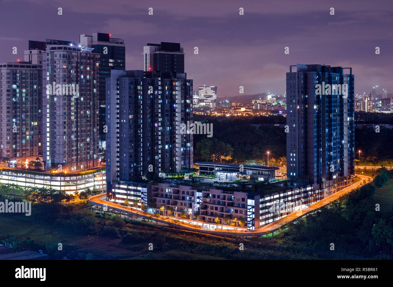 Dark city scene, night hours, light is on in the houses, the end of the ...