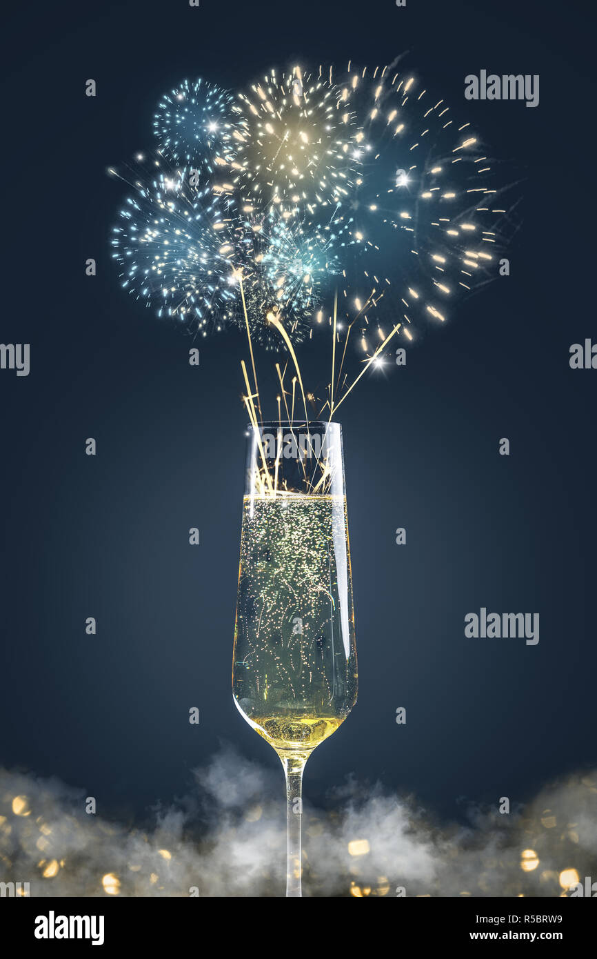 Champagne glass emitting a display of fireworks Stock Photo - Alamy