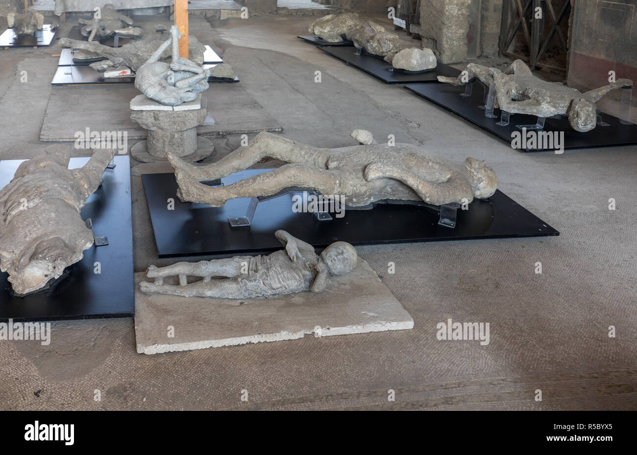 Gypsum cast of people in their last moments of life in ancient city of ...