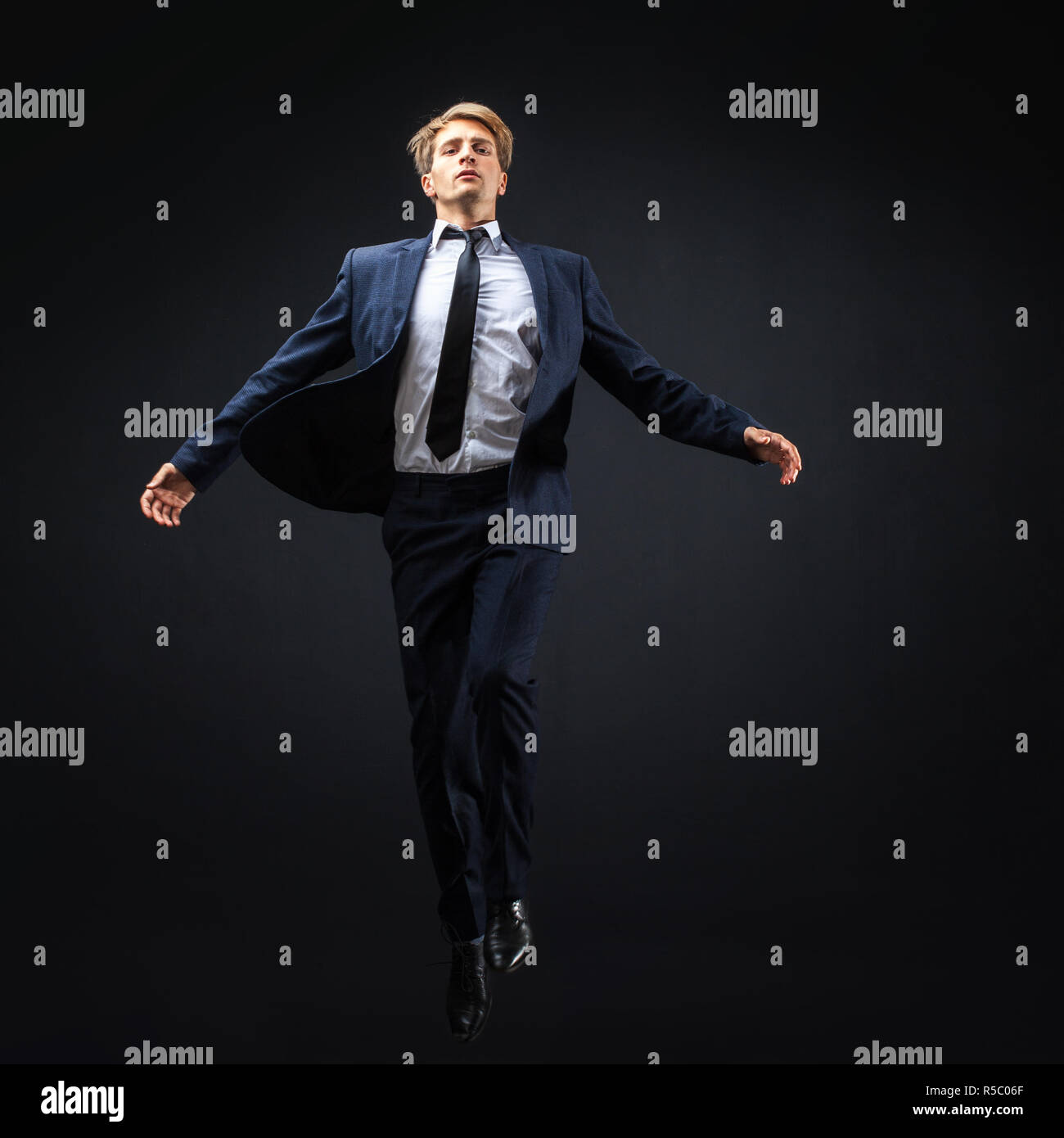 Man in suit falling hi-res stock photography and images - Alamy