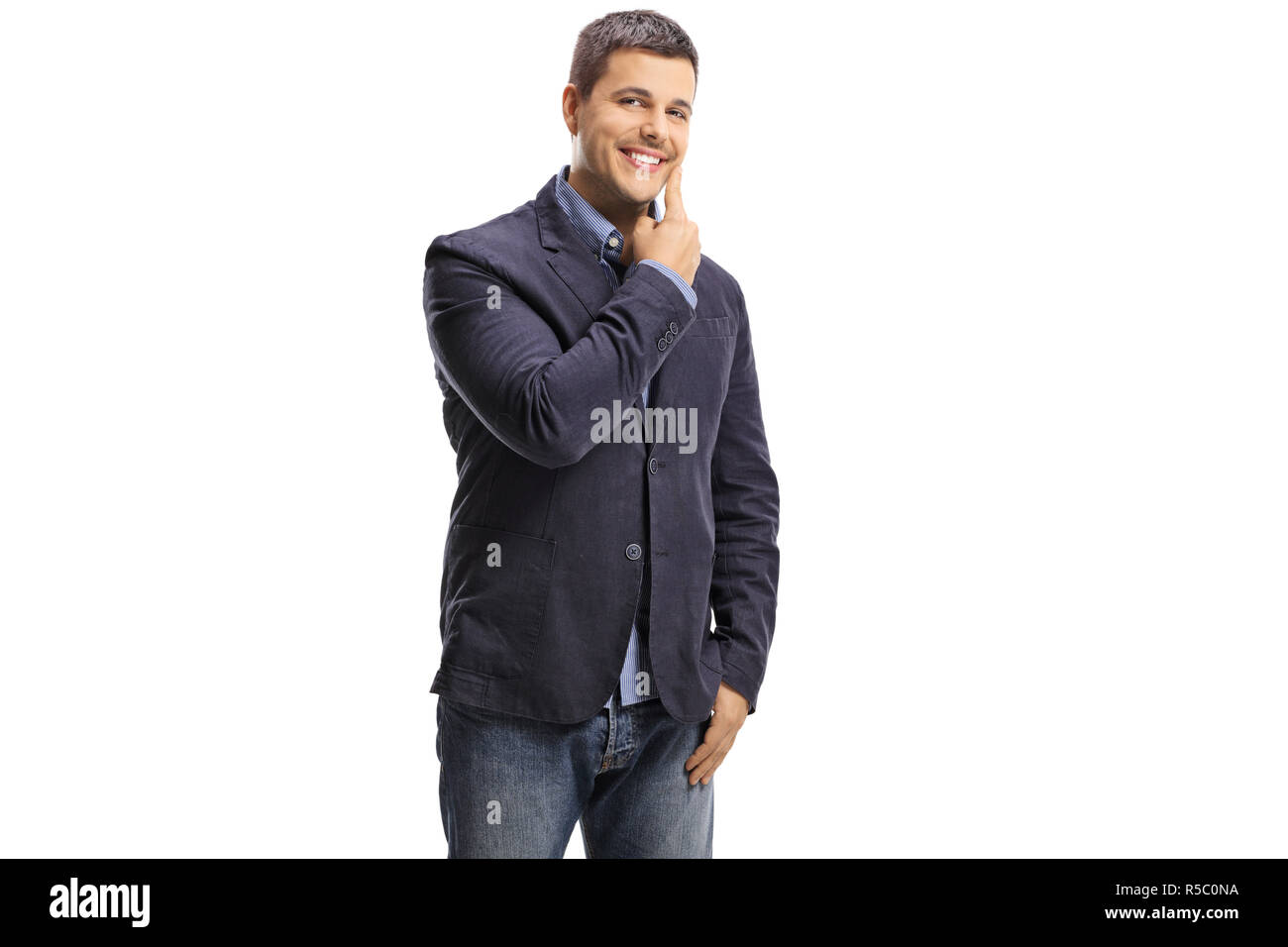 Handsome young man pointing on his cheek isolated on white background ...