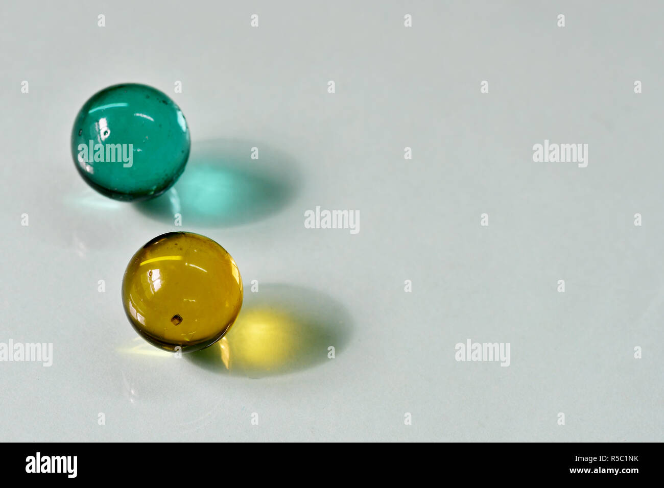 Marbles at close up photo with reflections and shadows Stock Photo - Alamy