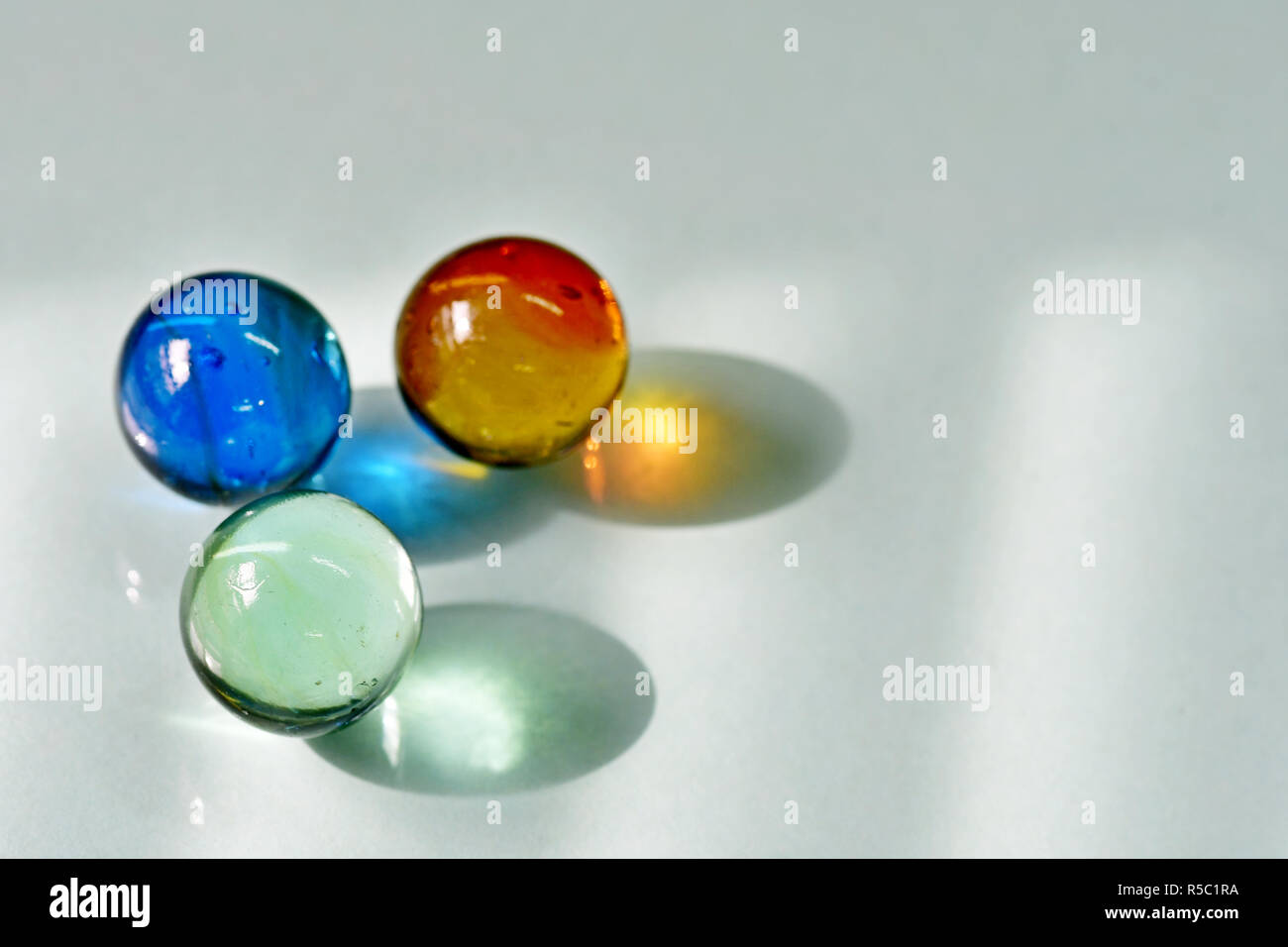 Marbles at close up photo with reflections and shadows Stock Photo - Alamy
