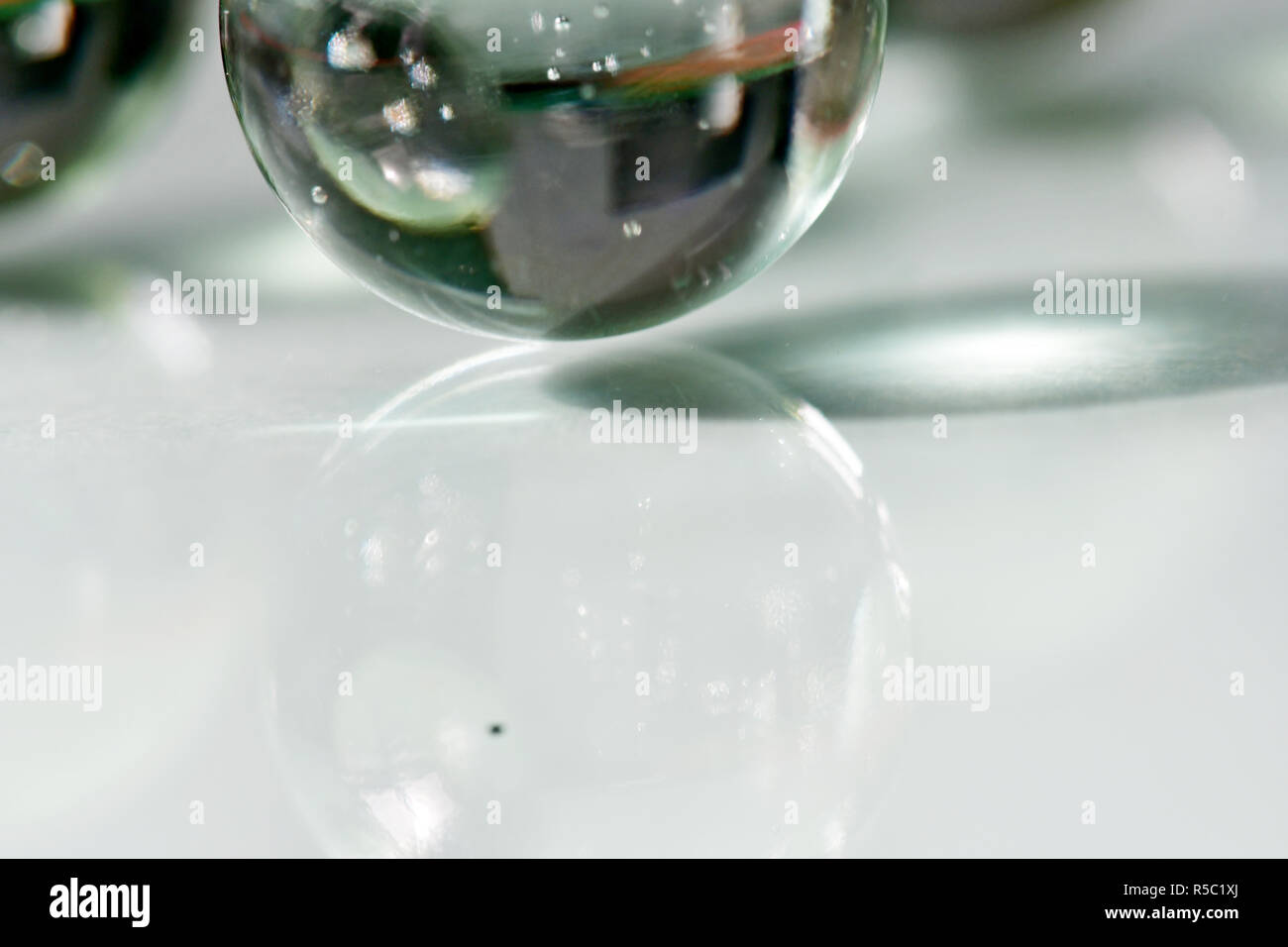 Marbles at close up photo with reflections and shadows Stock Photo - Alamy
