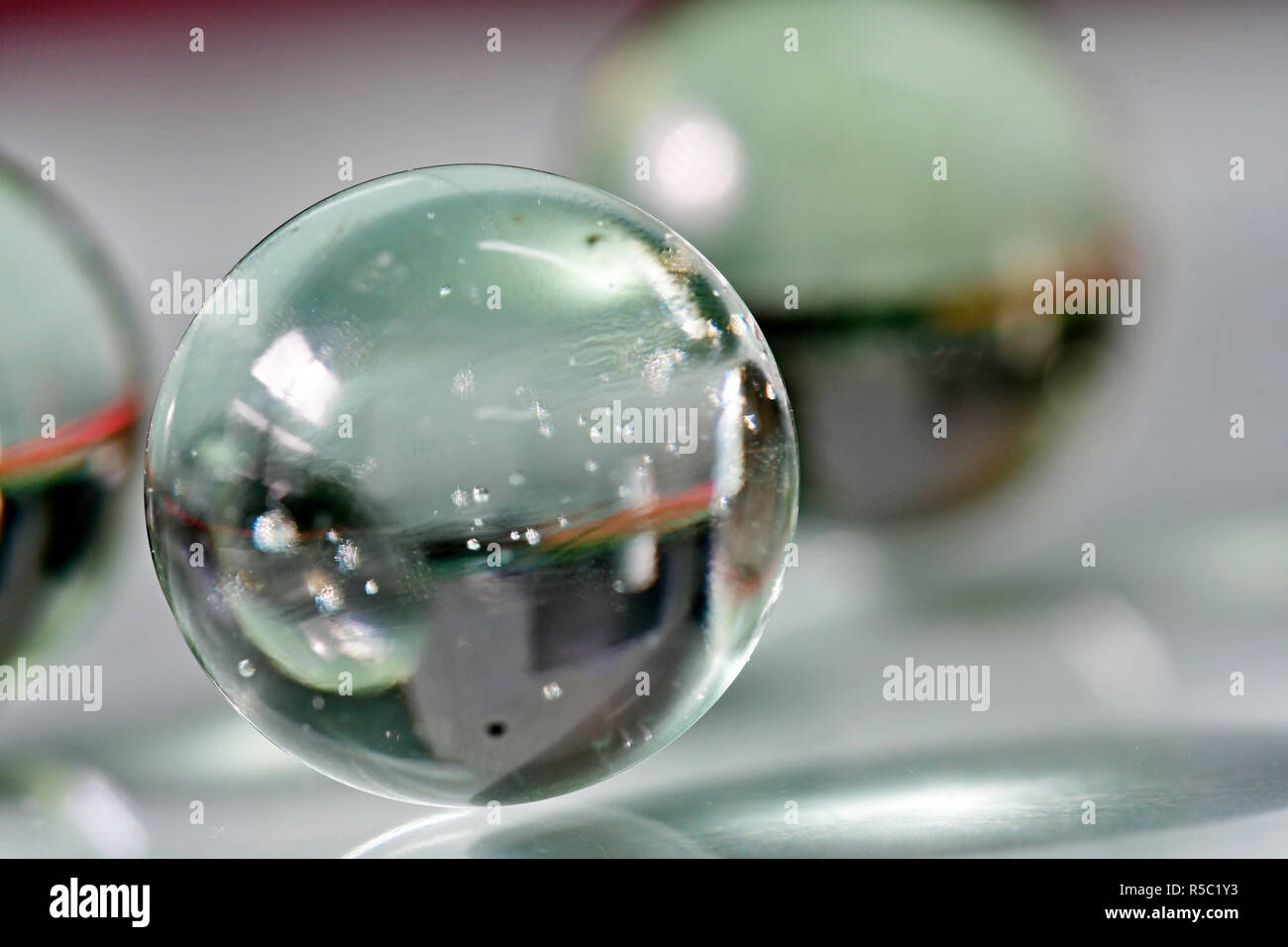 Marbles at close up photo with reflections and shadows Stock Photo - Alamy