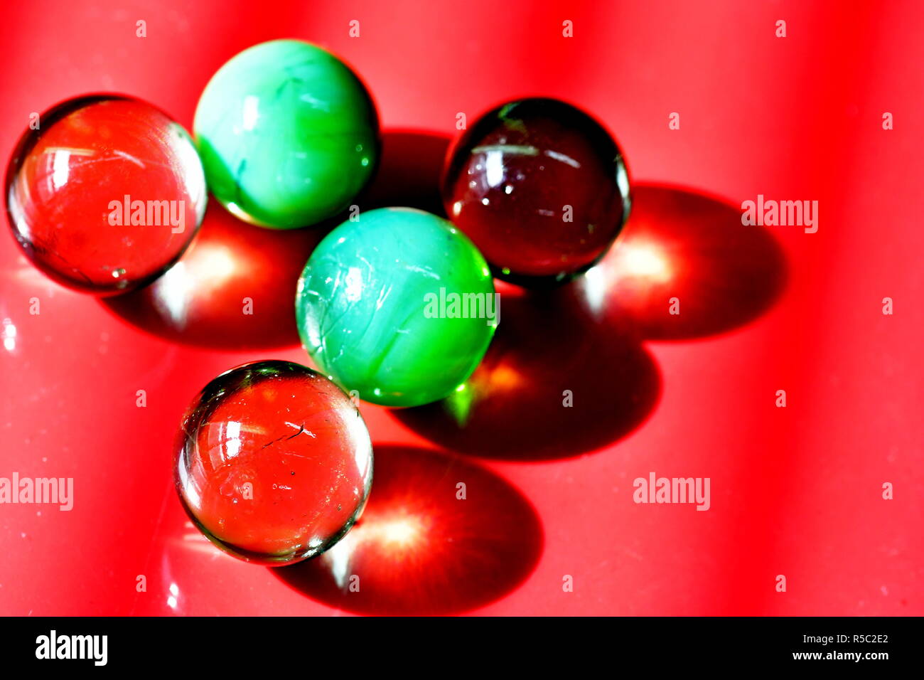 Marbles at close up photo with reflections and shadows Stock Photo - Alamy